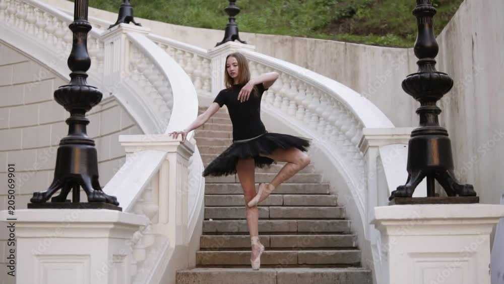 Front view of a graceful ballet movements. Young, blonde haired ...