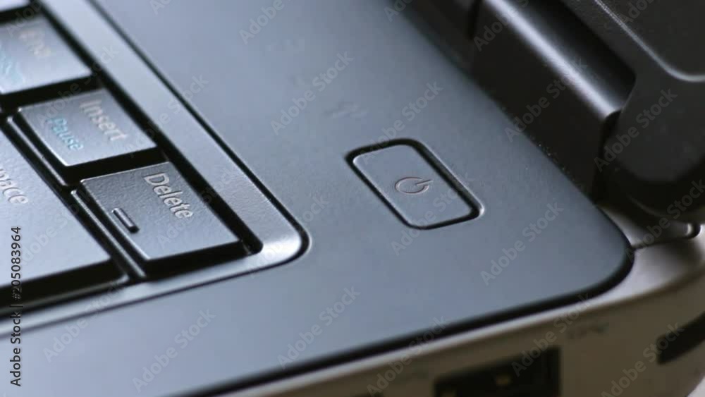 Pressing Power Button To Turn On the Laptop vídeo do Stock | Adobe Stock