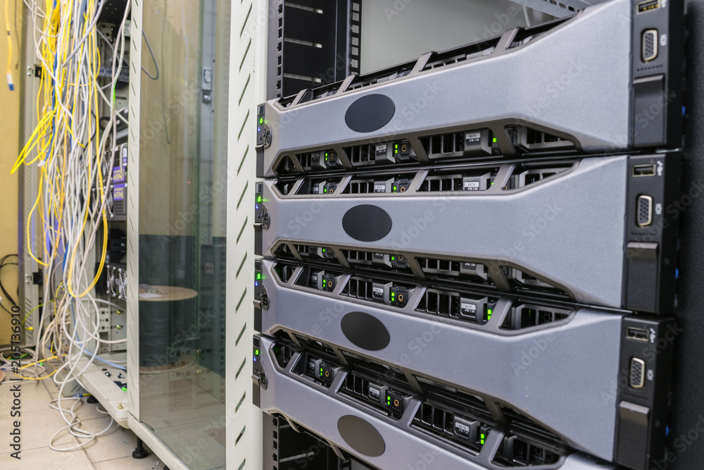 Database servers are installed in the racks in the server room. A ...