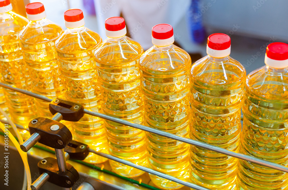 Sunflower oil. Factory line of production and filling of refined oil ...