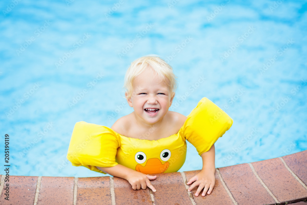 Baby in swimming pool. Kids swim aid. Stock Photo | Adobe Stock