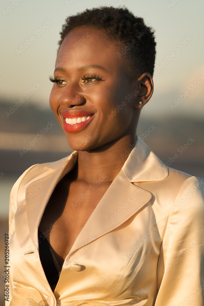 Young black model posing for fashion photography at beach setting in ...