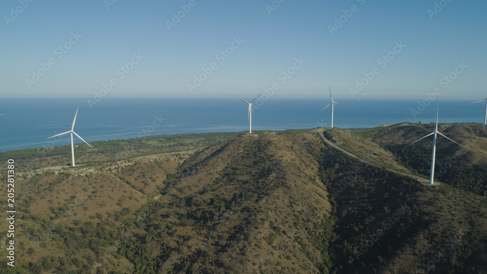 Aerial view of Windmills for electric power production on the seashore ...