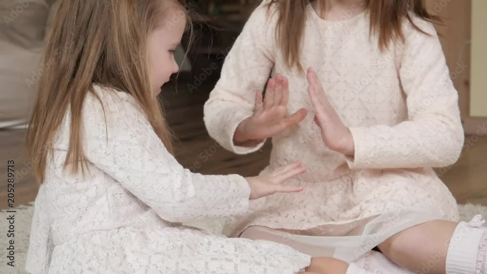 Little girls Kids play a Hand Game rock-paper-scissors at Home having ...
