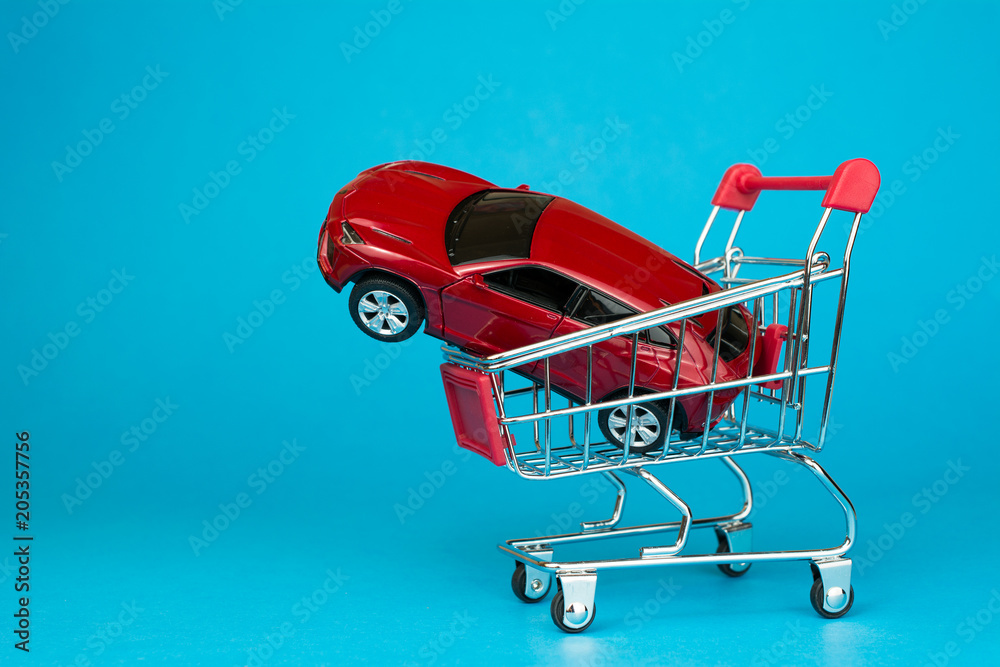 auto dealership and rental car concept. red car shopping cart blue ...