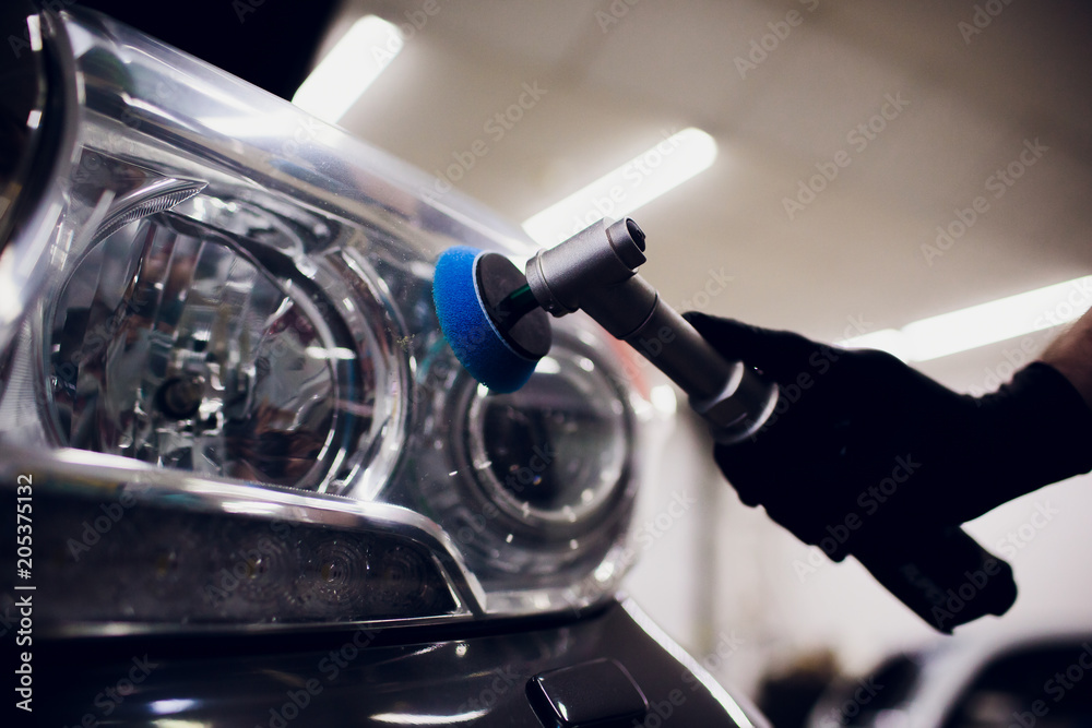 Car polish wax worker hands holding polisher and polish car detailing ...