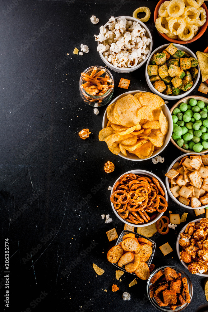 Variation different unhealthy snacks crackers, sweet salted popcorn ...