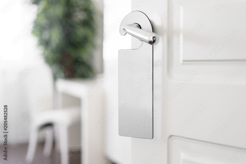 Door knob with empty label on a door handle for your text. Empty white ...