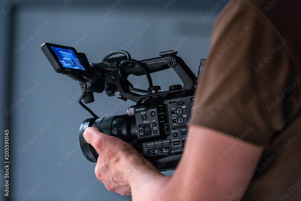 camera operator working with a cinema camera Stock Photo | Adobe Stock