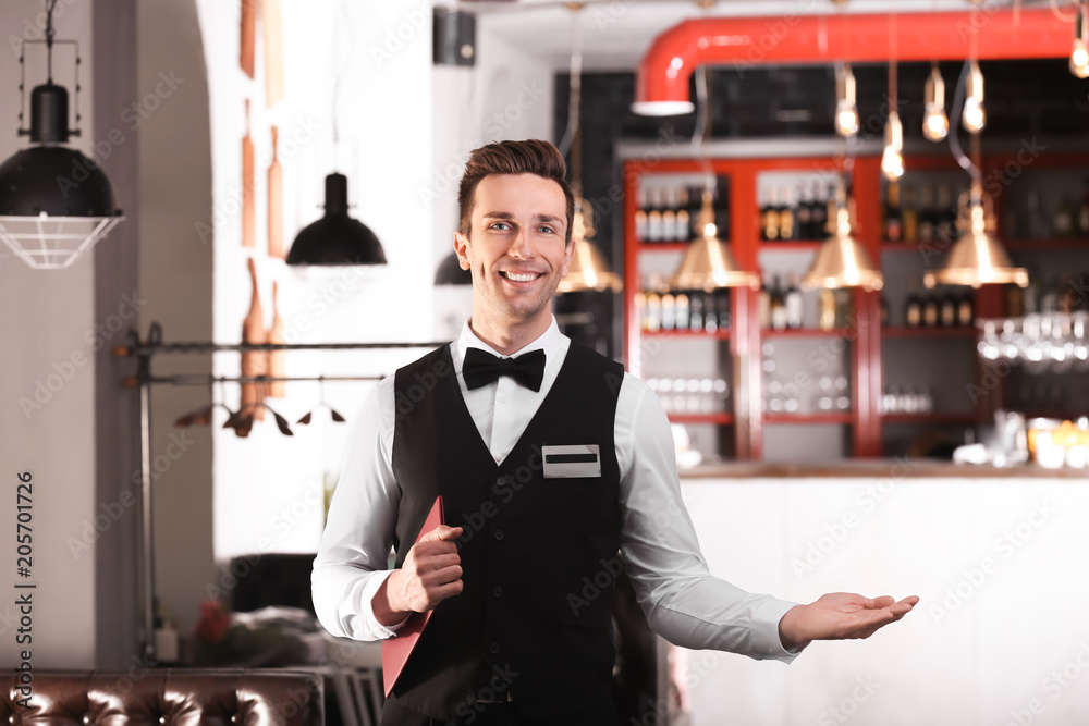 Waiter in elegant uniform with menu at workplace Stock Photo | Adobe Stock