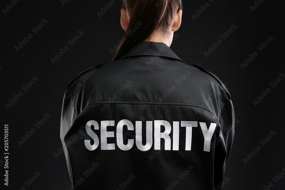 Female security guard in uniform on dark background, closeup Stock ...