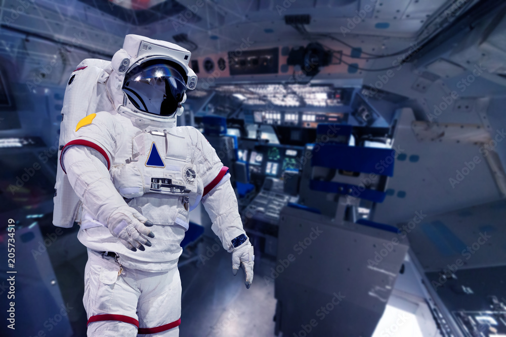 Astronaut pressure suit in a space shuttle cockpit ( NASA image not ...