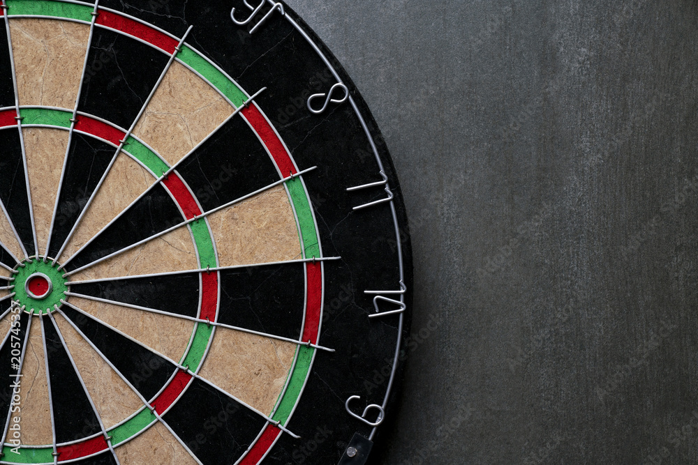 Target dart board on the black background, center point, head to target ...