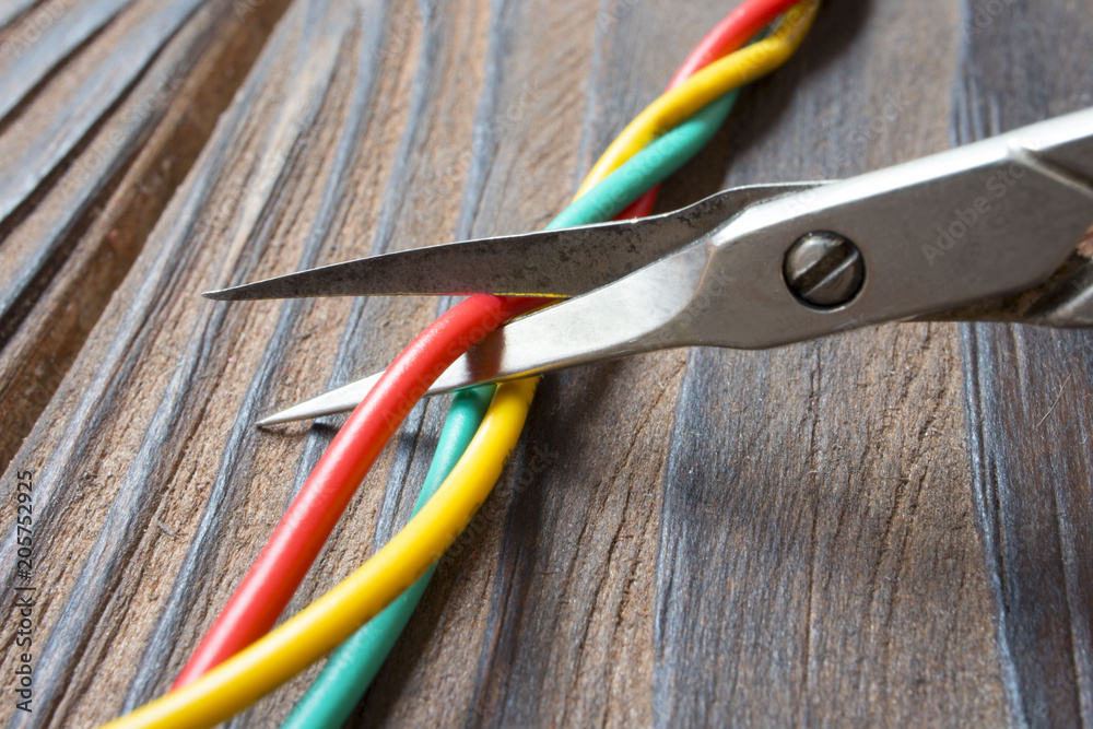 Dismantling electronic bomb, tongs cut the red wire on a bunch of ...