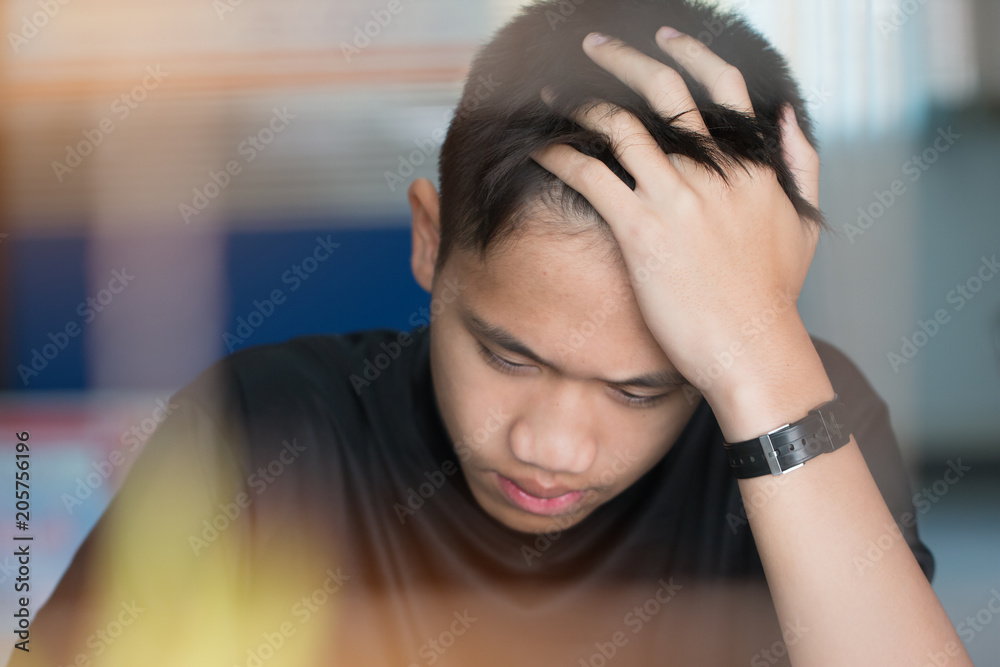 Education test concept : Asian boy student studying stressed headaches ...