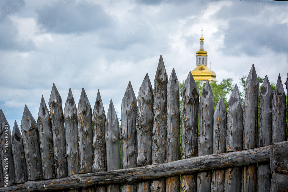 Medieval wooden fence made of palisade Stock Photo | Adobe Stock