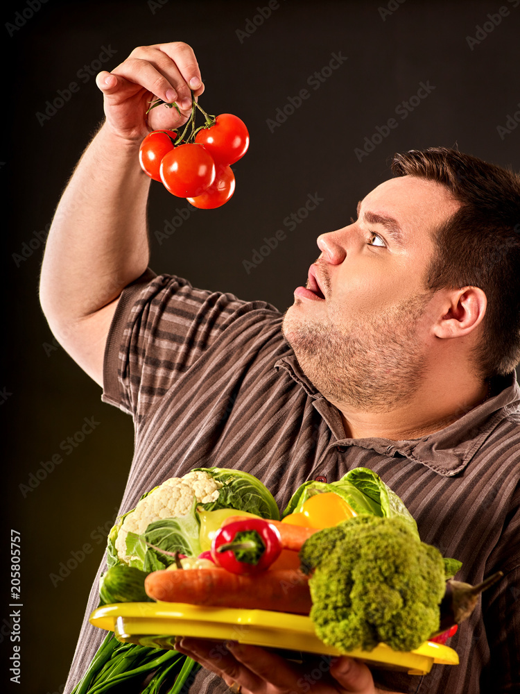 Diet fat man eating healthy food. Health breakfast with vegetables ...