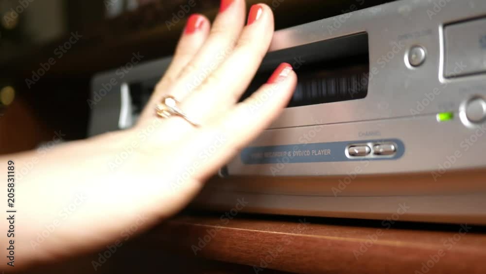 Inserting a VHS Tape into VHS player - normal style ALT VERSION Stock ...