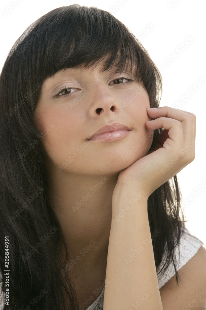 Beautiful Caucasian young female model with long dark hair resting chin ...