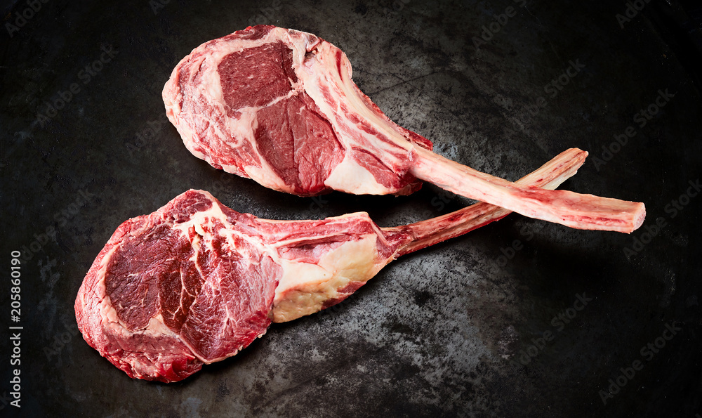 Two uncooked fatty ribeye or Delmonico steaks Stock Photo | Adobe Stock