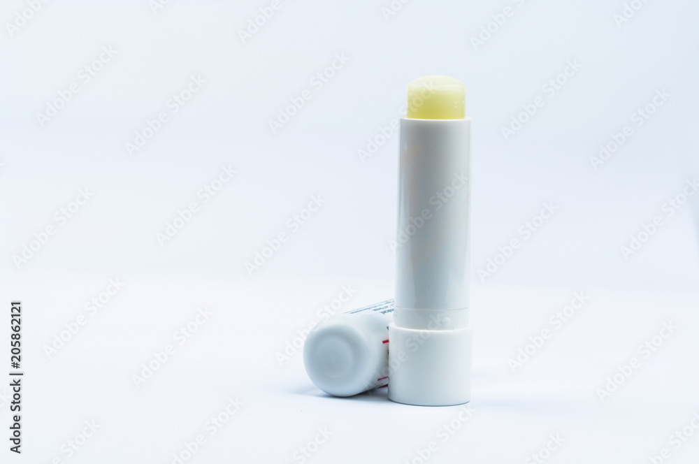 Lip balm for dry, sensitive lips. Opened cap lip care isolated on white ...