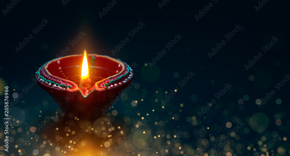 Diya lamp with magical particle Stock Photo | Adobe Stock