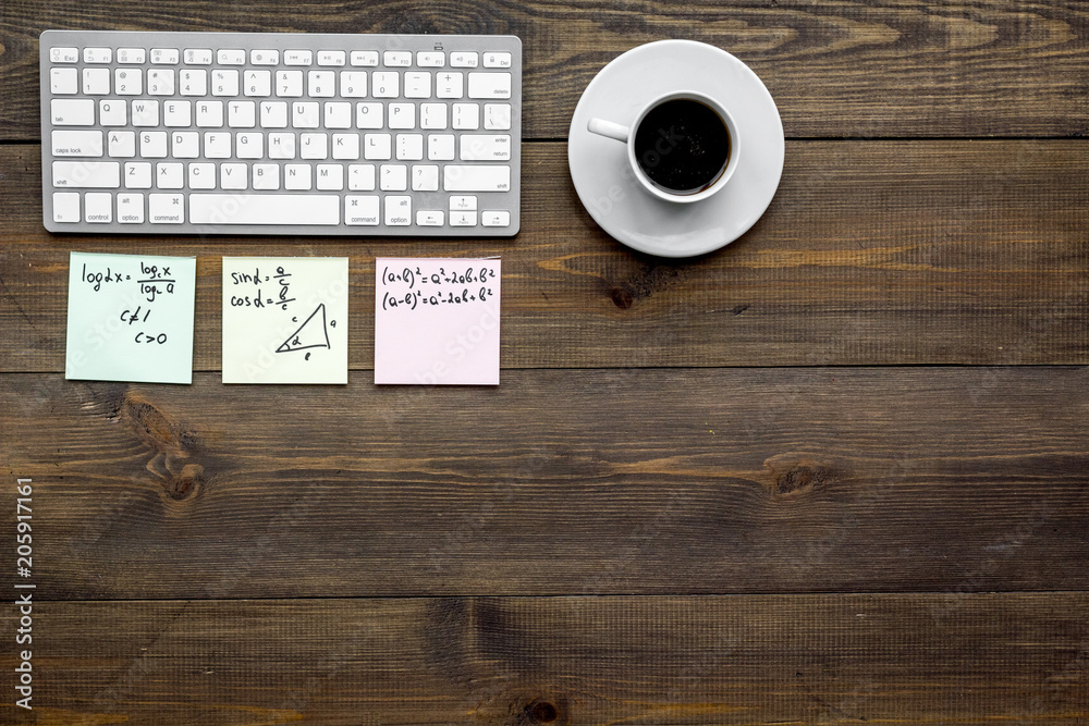 Preparing for the exam. Student's desk with computer, cheat sheets on ...