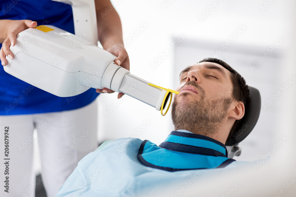 medicine, dentistry and healthcare concept - female dentist with x-ray ...