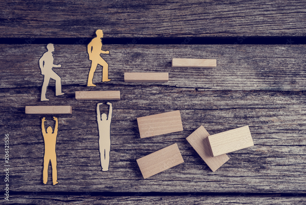 Retro toned image of silhouette people pushing others of opposite color ...