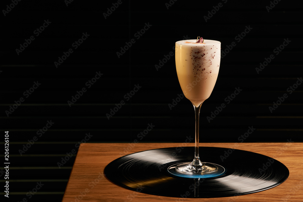 Classical Lucy cocktail on vinyl tray background. Cocktail with Gin ...