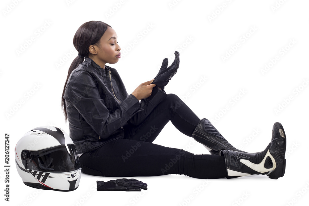 Black female racer or biker or stuntwoman sitting with a racing helmet ...