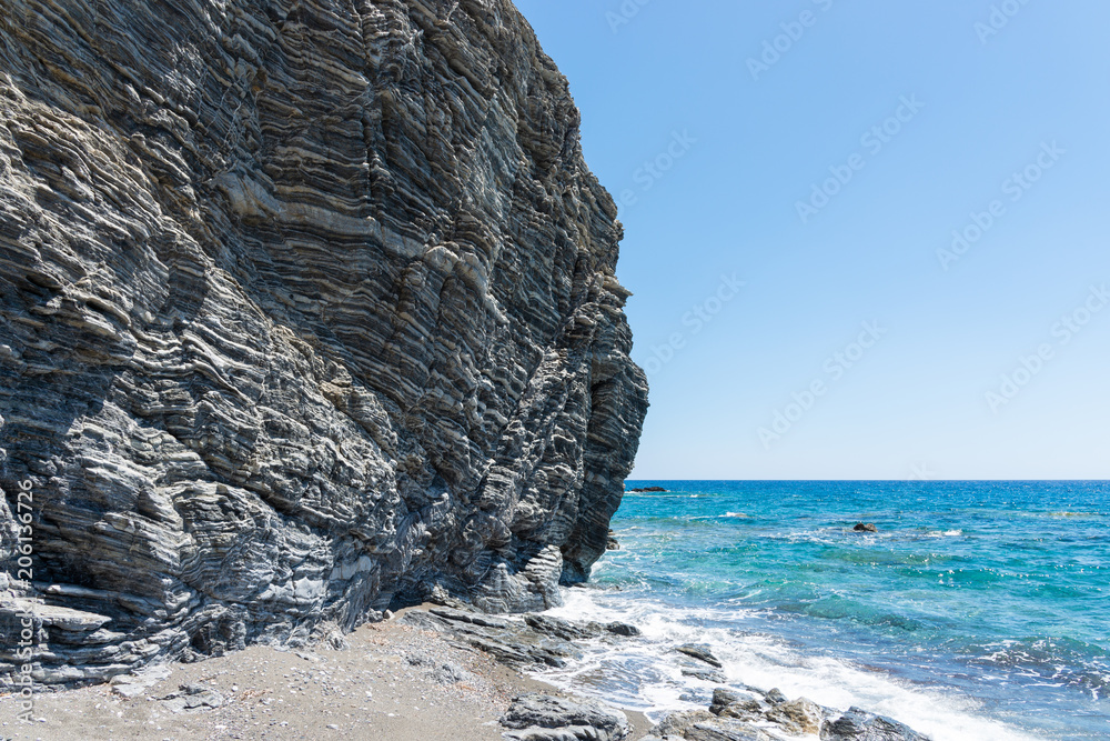 Compressed rock layers formation in various colors and thicknesses, on ...