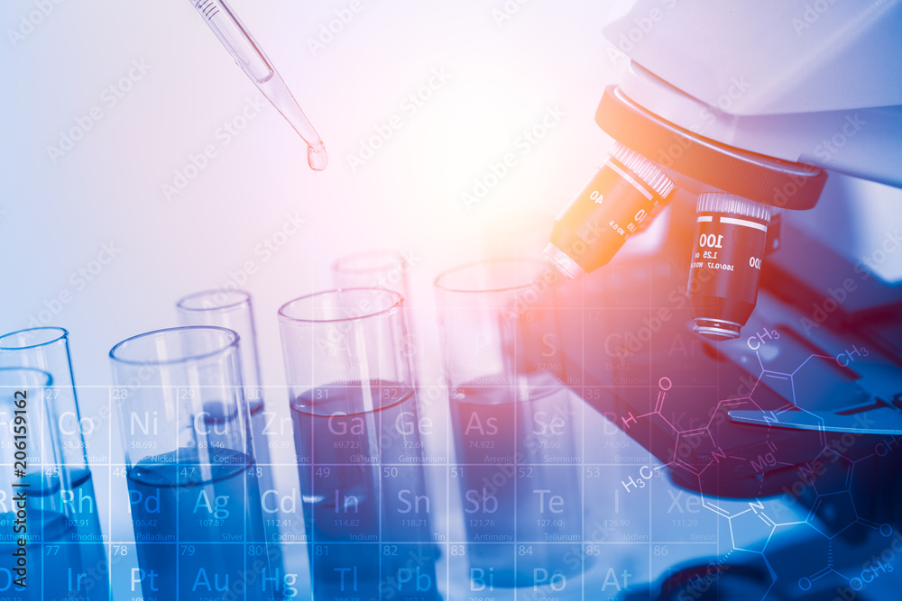 Science chemical research pipette dropping sample liquid into test tube ...