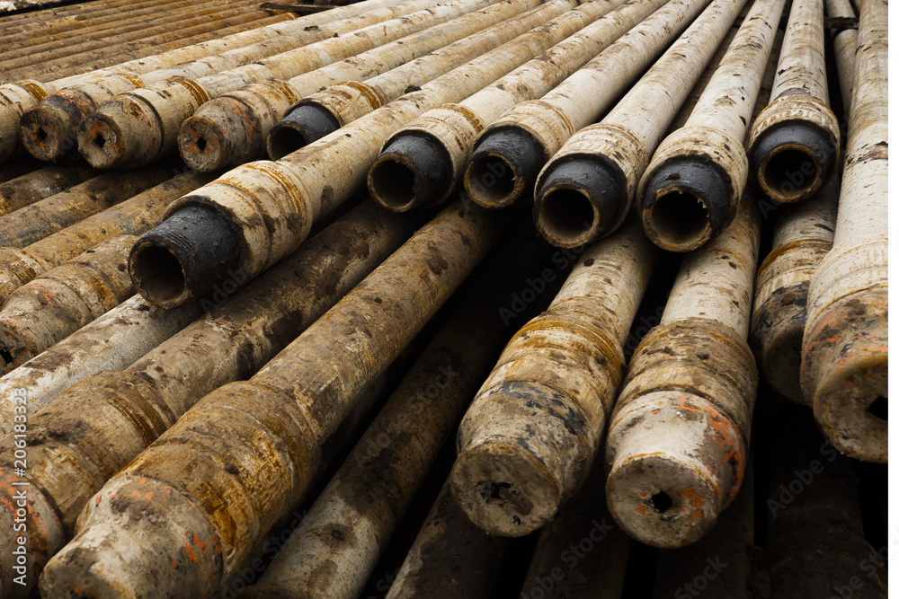 Oil drill pipe, Drill Pipe Stacked on Pipe Deck Stock Photo | Adobe Stock