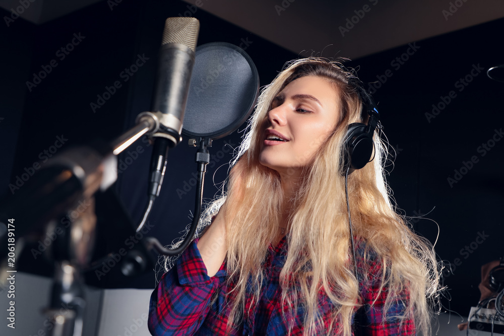 Music expresses you! Side view portrait of the young woman singer with ...