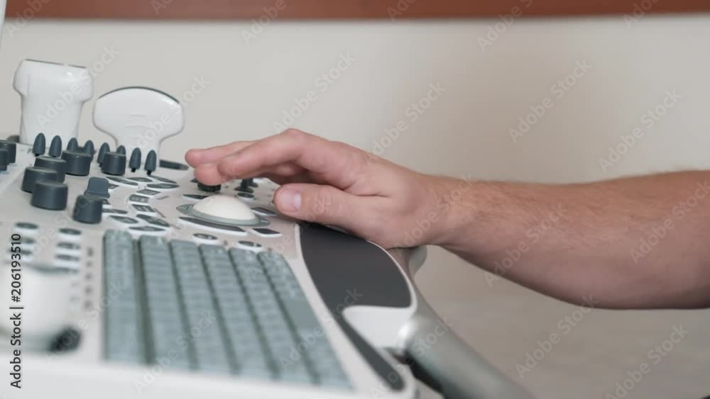 The doctor's hand close-up. How does the ultrasound machine work ...