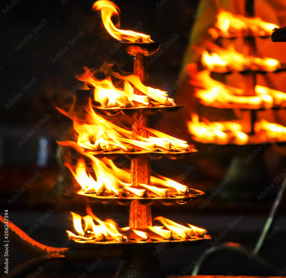 Candles used in performance of religious Ganga Aarti ritual fire puja ...