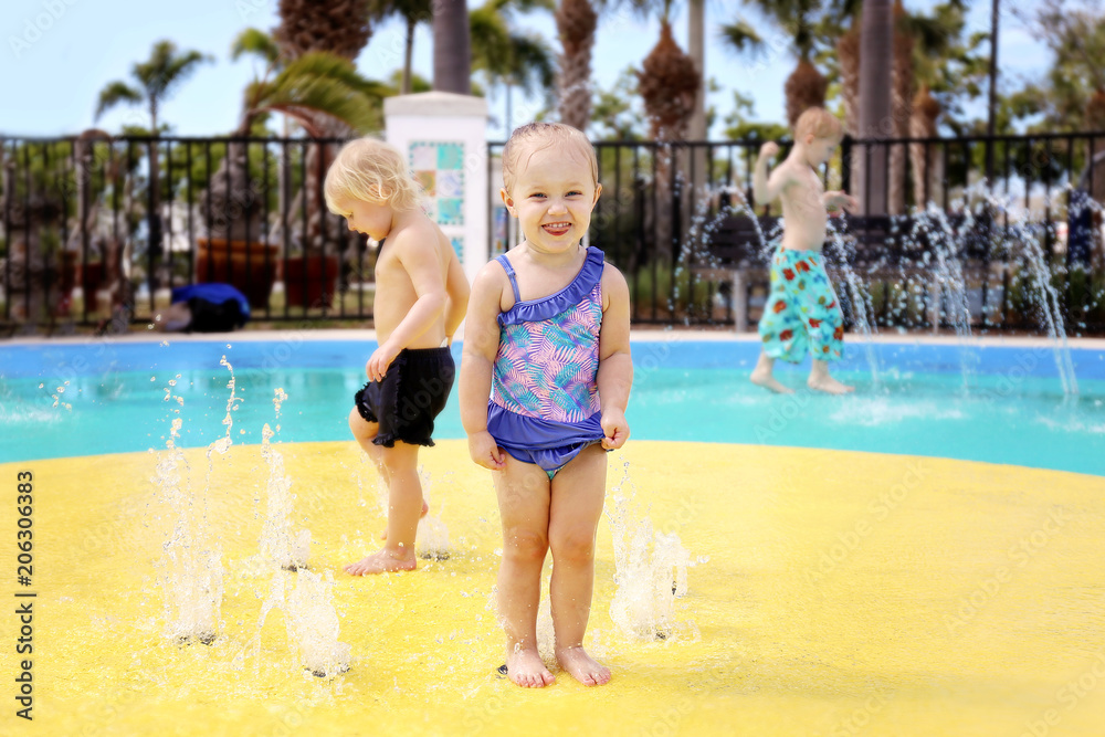 Cute Little Toddler Girl Playing in a Splash Park with Friends Outside ...
