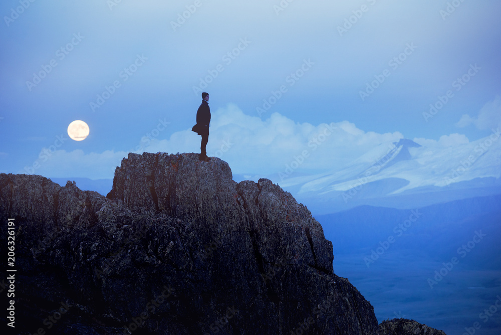 Man Standing Alone On Cliff