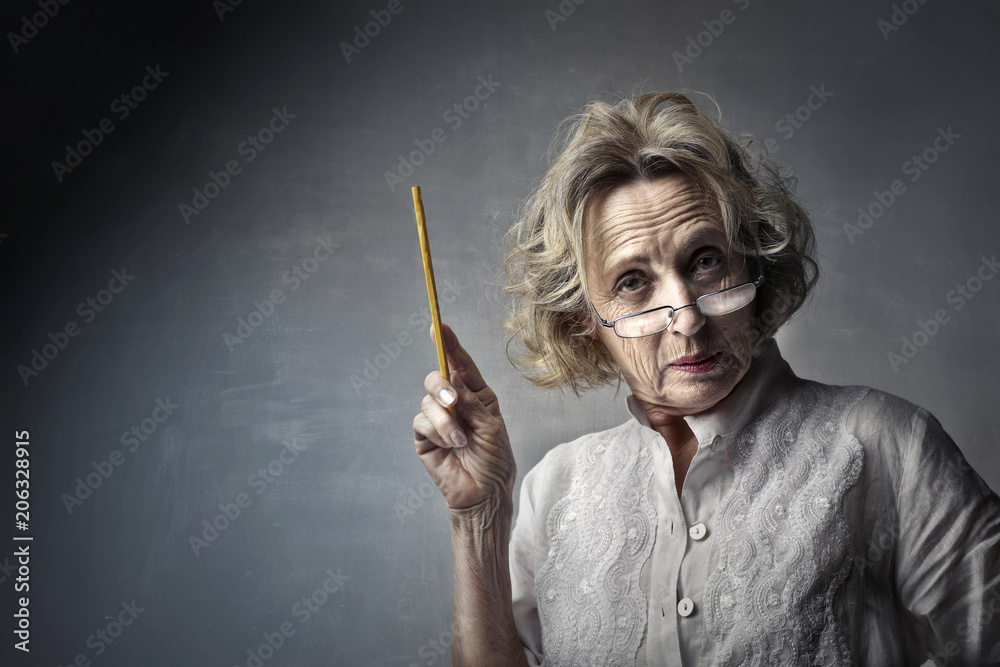 Portrait of serious teacher Stock Photo | Adobe Stock