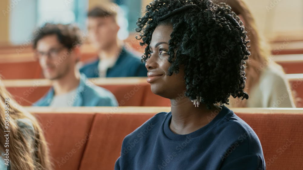 Beautiful Black Female Student Sitting Among Her Fellow Students in the ...