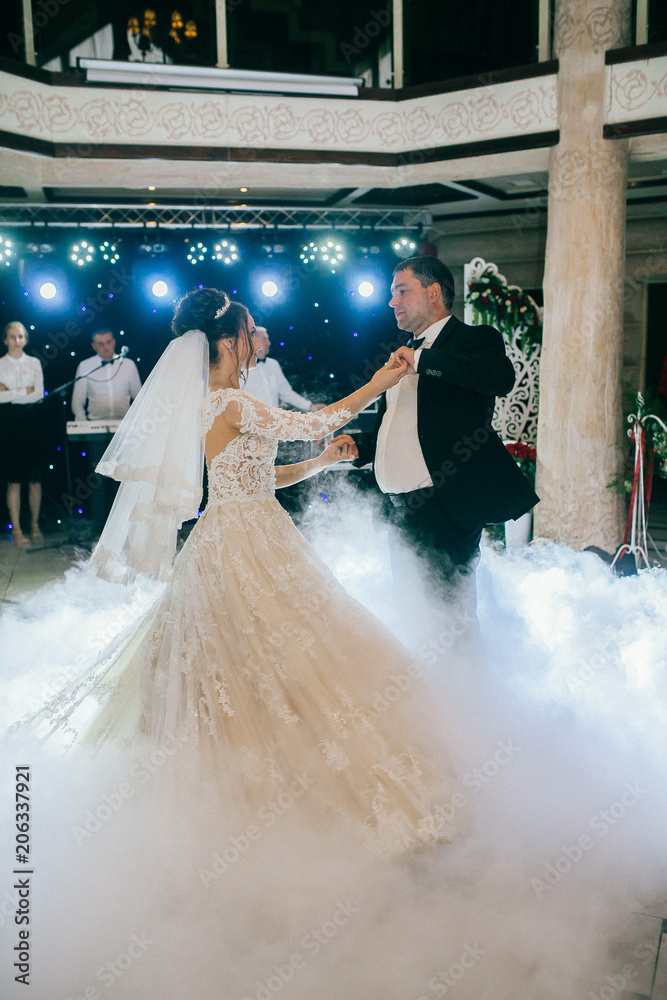 First wedding dance of newlywed. Amazing dancing bride and groom on low ...