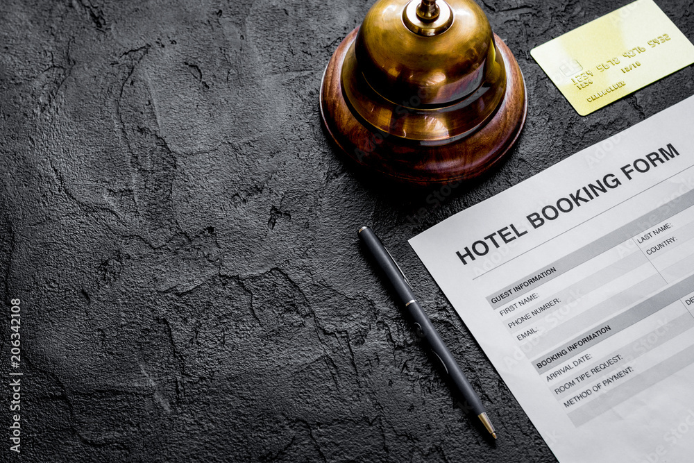 reservation form on hotel reception dark desk background Stock Photo ...