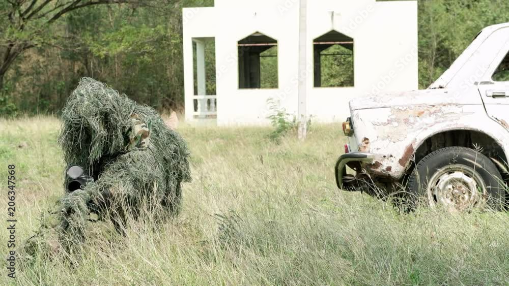 Sniper preparing his sniper rifle in urban combat training ground ...