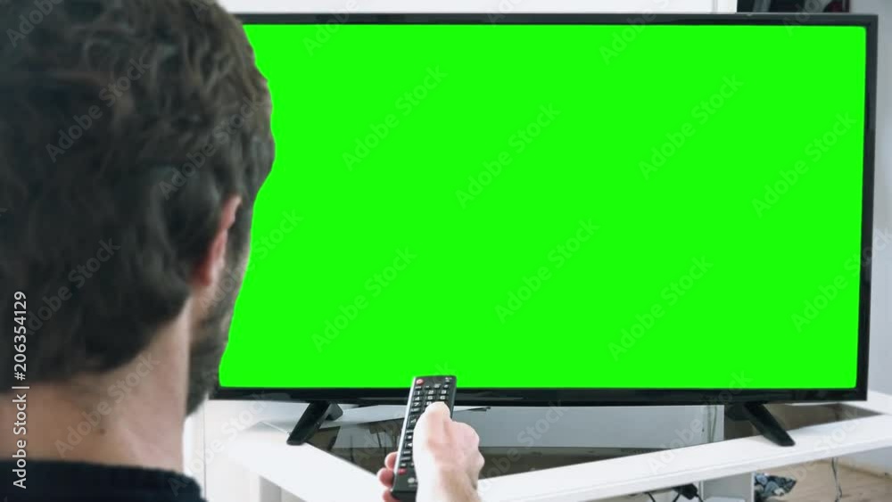 Changing Channels TV Television Green Screen. Man changing channels on ...