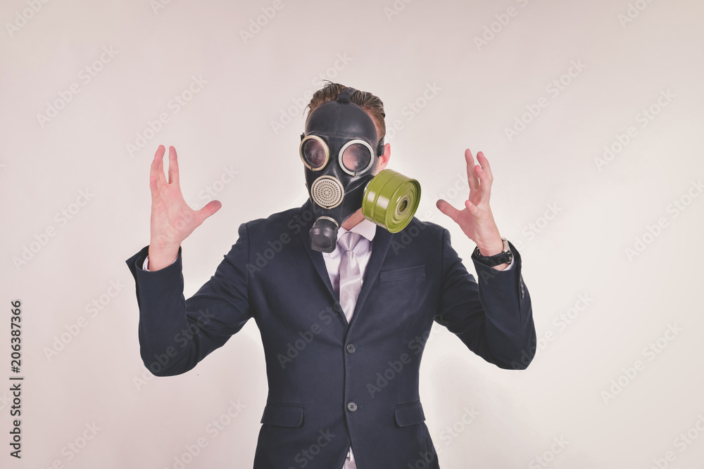 Business Concepts. Businessman wearing a gas mask on a white background ...