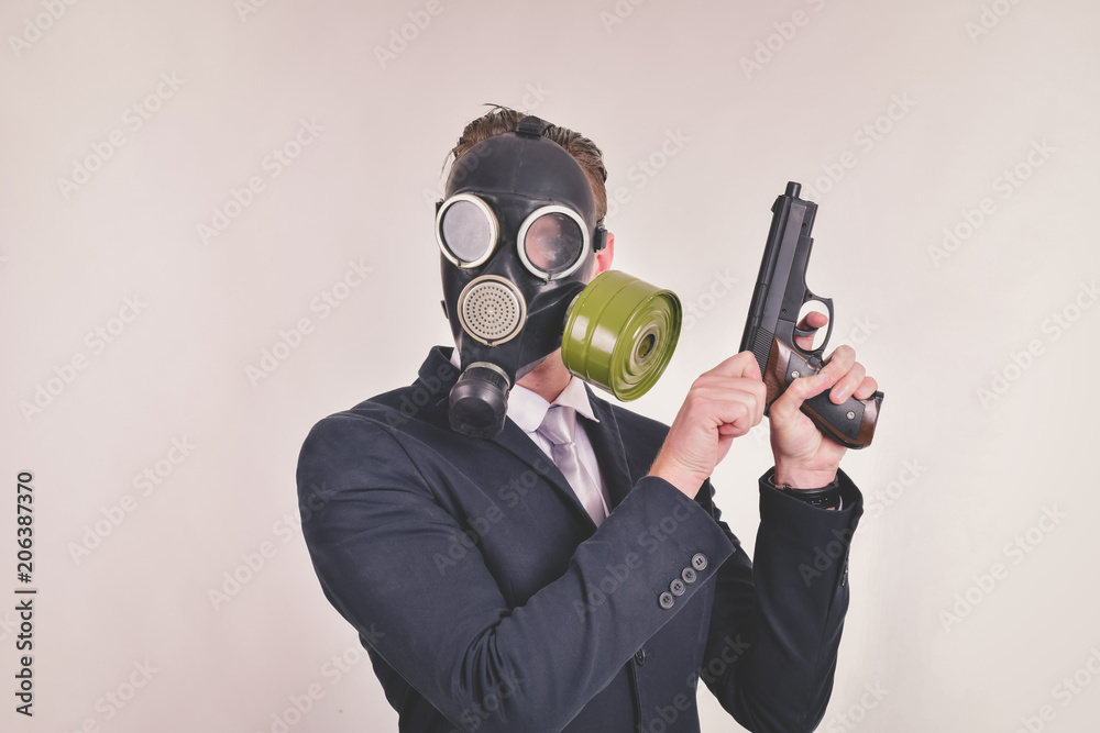 Business Concepts. Businessman wearing a gas mask on a white background ...