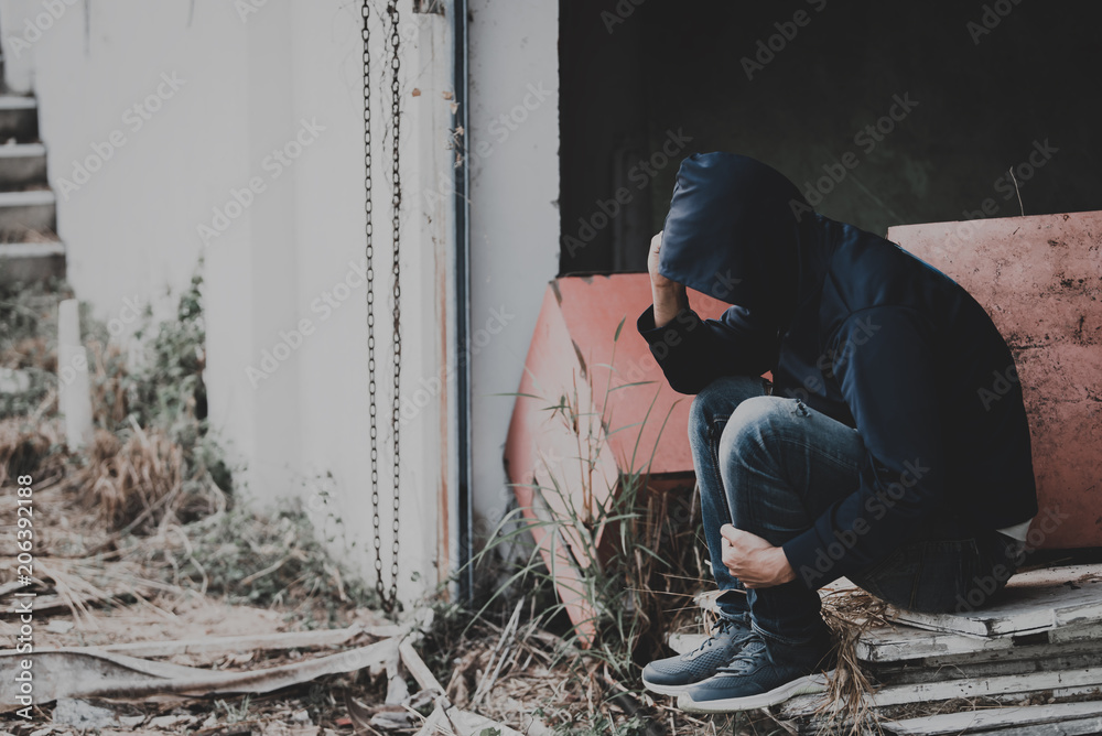 Portrait of asian man sad,drug addict man sitting on the floor,flakka ...