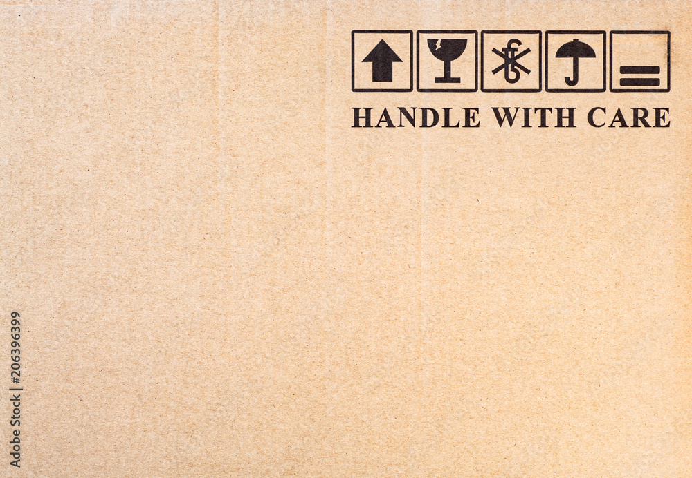 Fragile symbol on cardboard background. Stock Photo | Adobe Stock