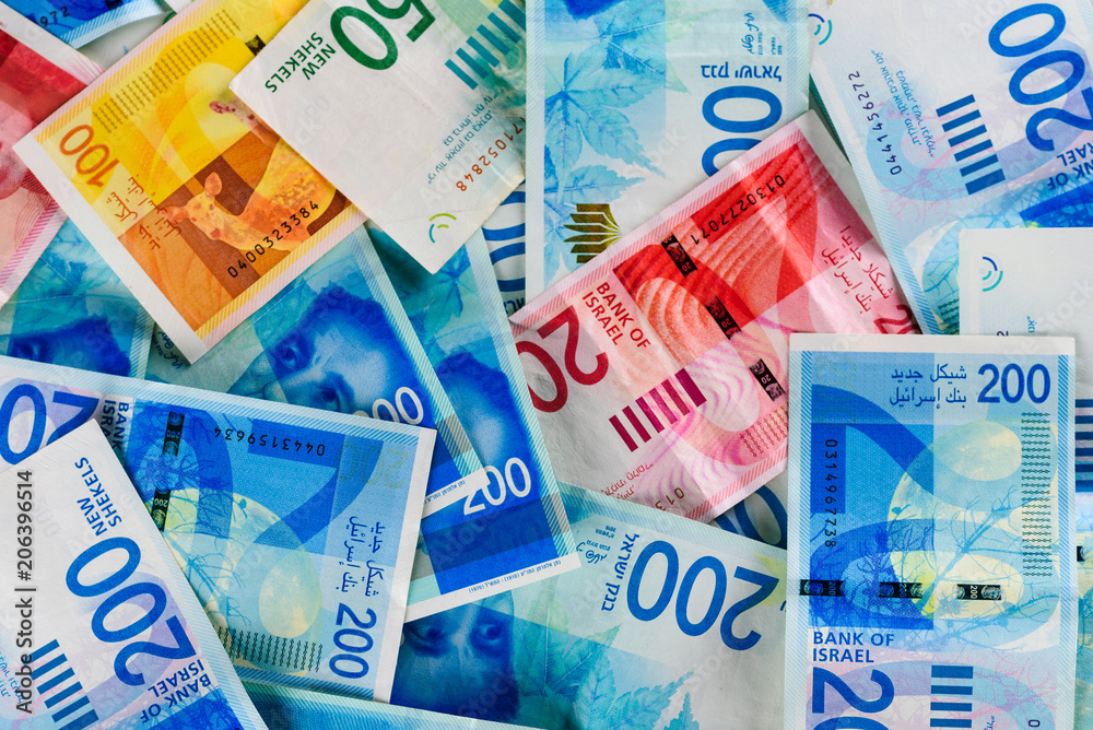 Stack of various Israeli shekel bills. Israel money banknotes of 50, 20 ...